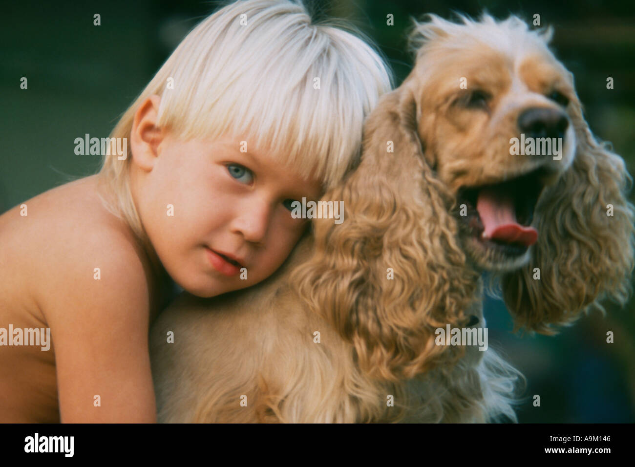 child hugging dog Stock Photo - Alamy