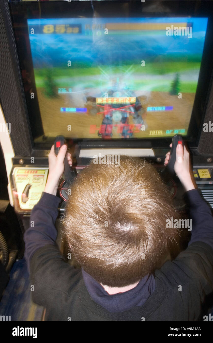 Teenager boy playing game in arcade hi-res stock photography and images ...