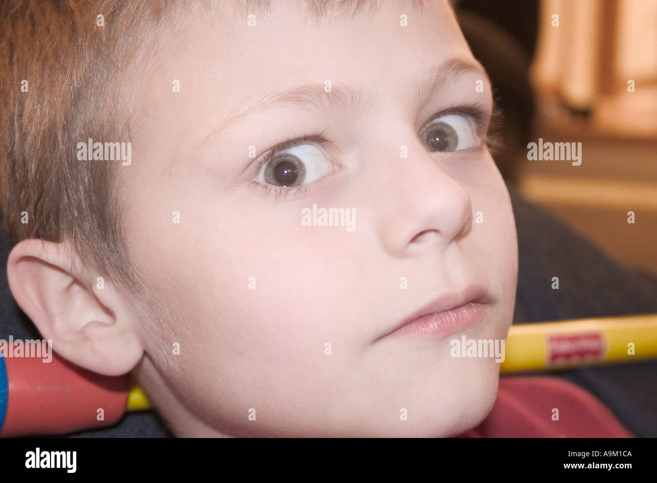 Boy age 8 making funny face Stock Photo - Alamy