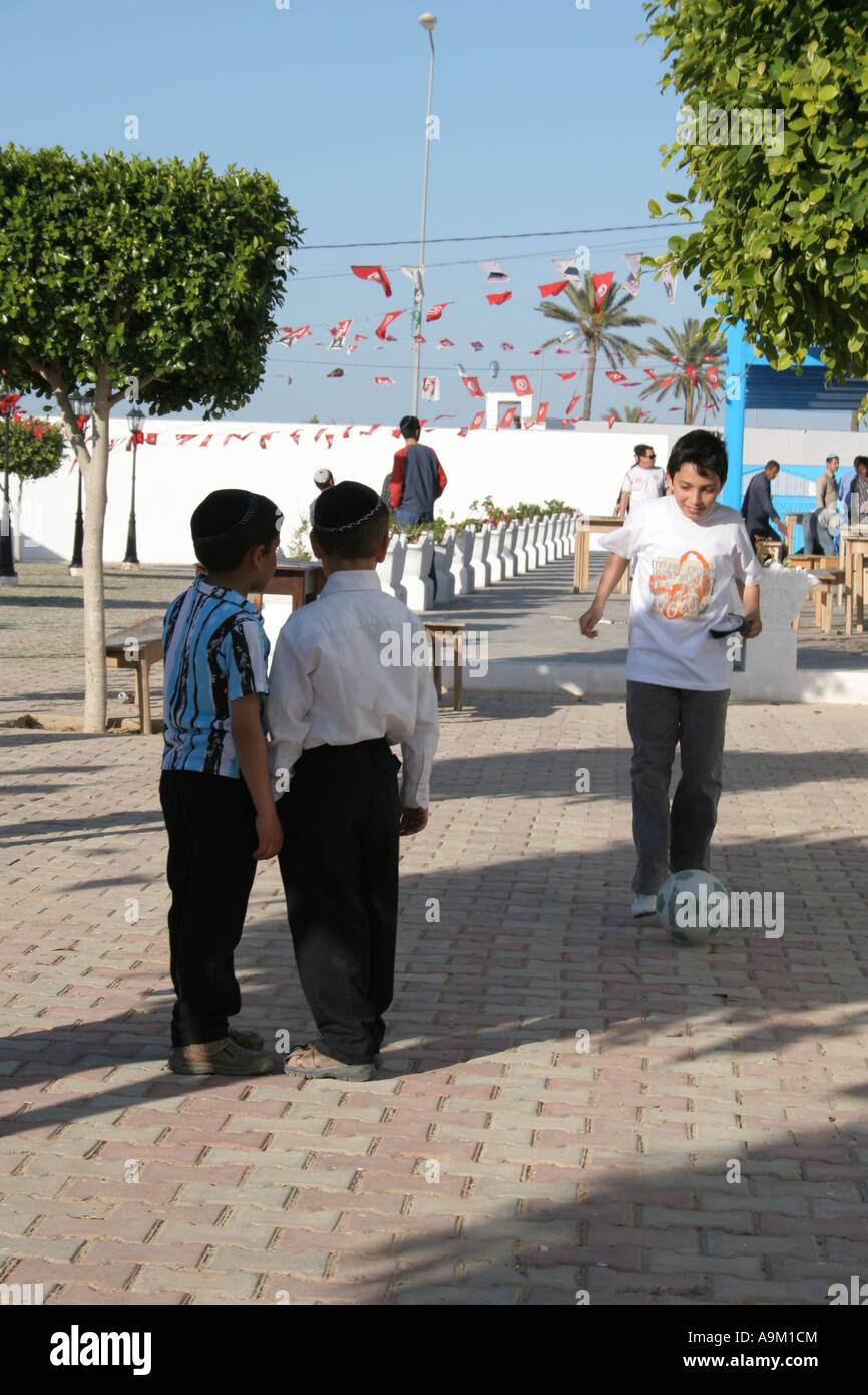 Jewish children playing football at the La Griba synagogue Djerba Stock ...