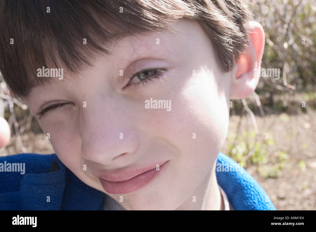 Boy age 8 making funny face Stock Photo - Alamy