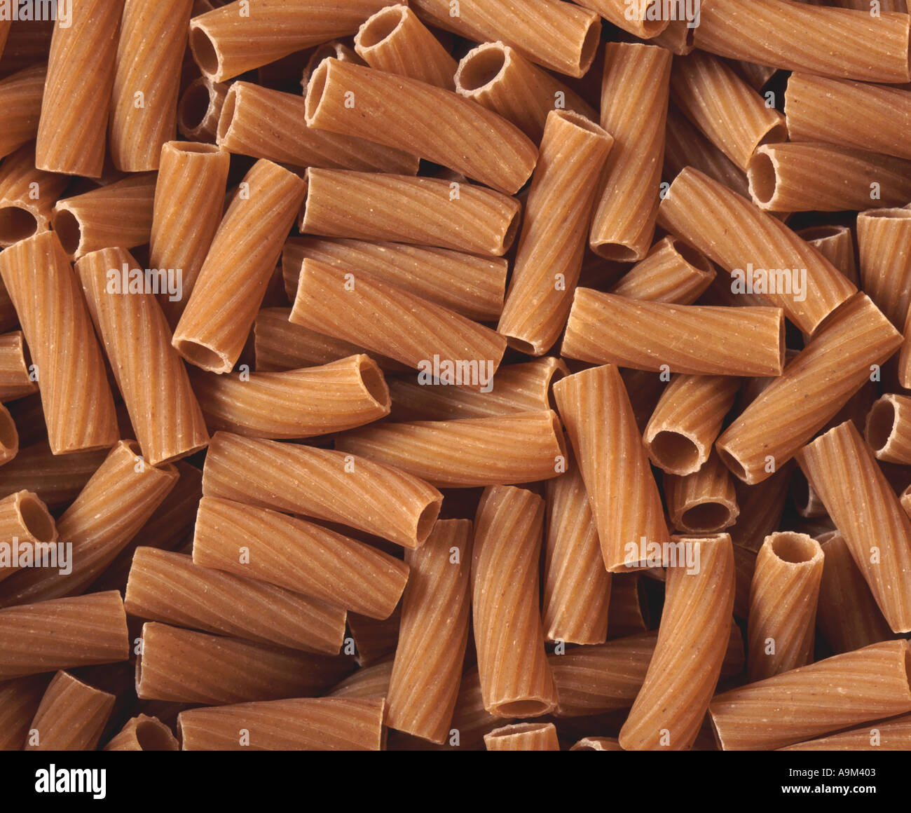 Dried wholemeal pasta type pipe rigate Stock Photo - Alamy