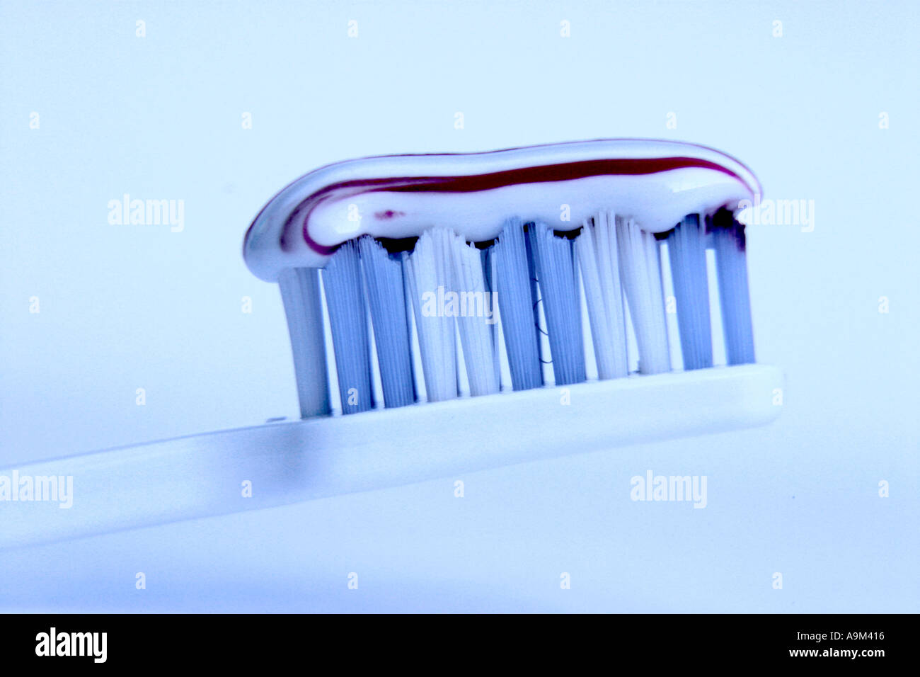 Toothbrush and Stripy Toothpaste Stock Photo - Alamy