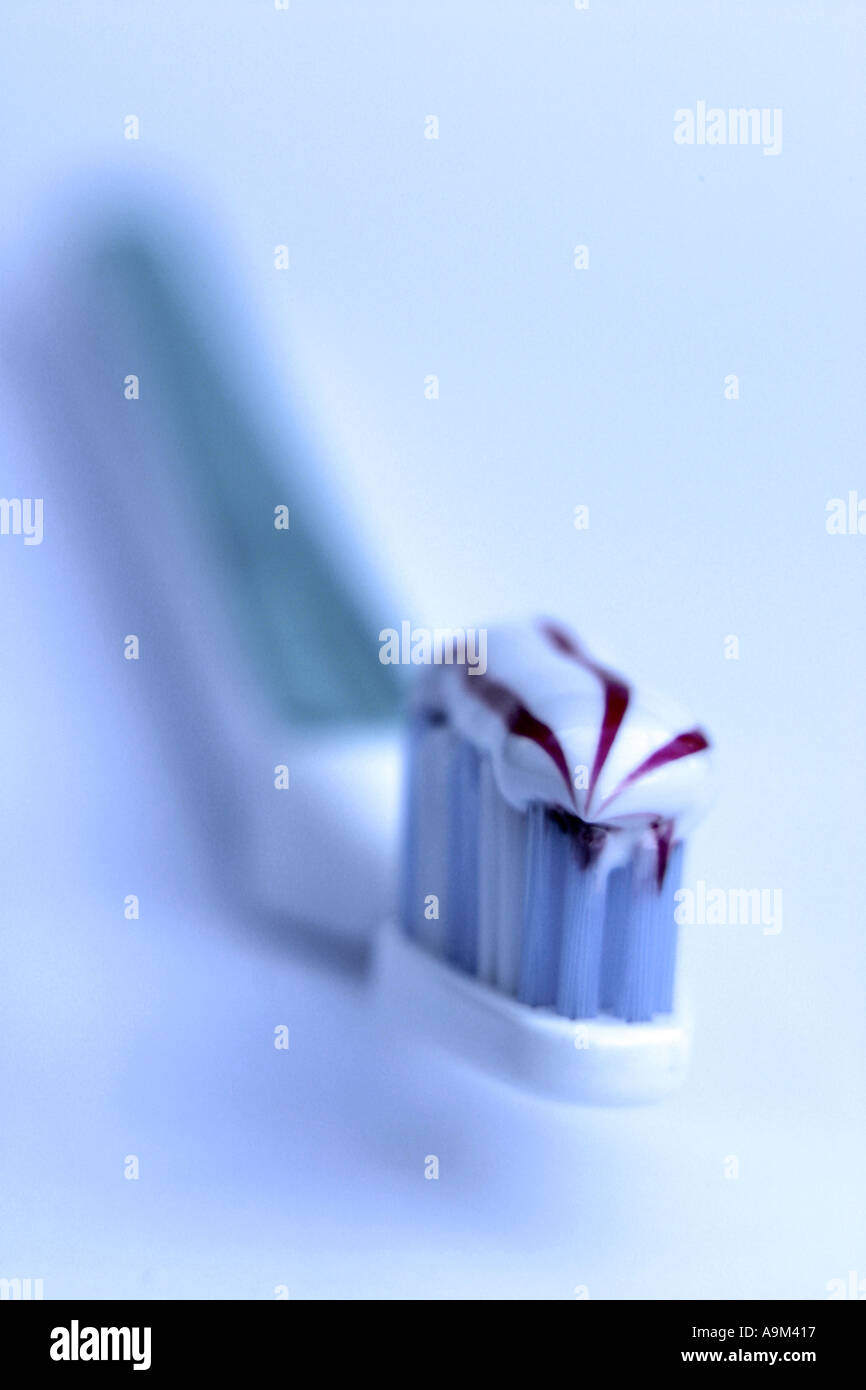 Toothbrush and Stripy Toothpaste Stock Photo - Alamy