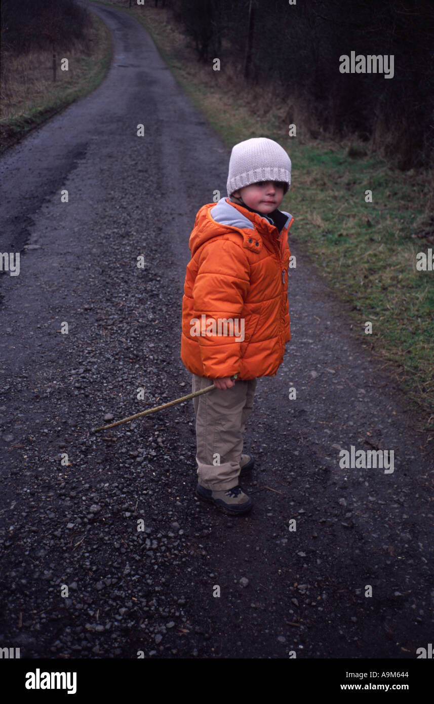 young child going for a winter walk all wrapped up against the cold ...