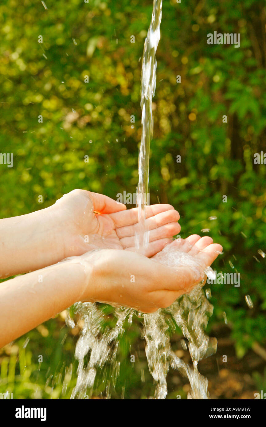 Girl hands in water fountain hi-res stock photography and images - Alamy