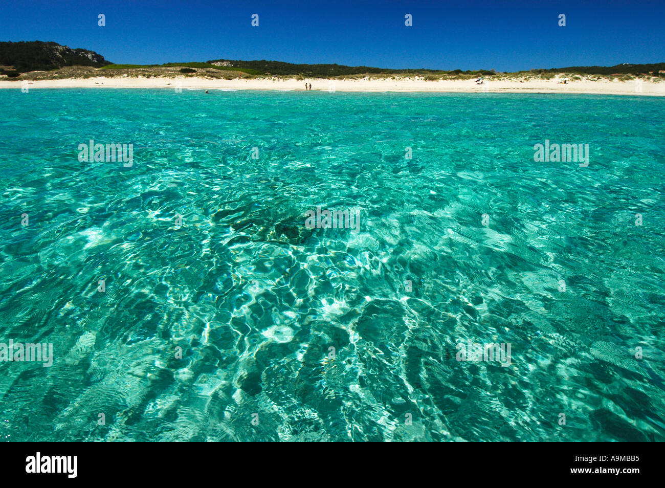 turquoise waters with the Binigaus beach in the distance Stock Photo ...