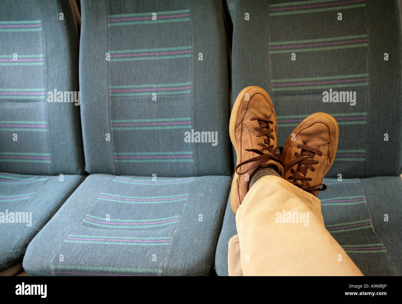 feet on seat in train carriage Stock Photo - Alamy