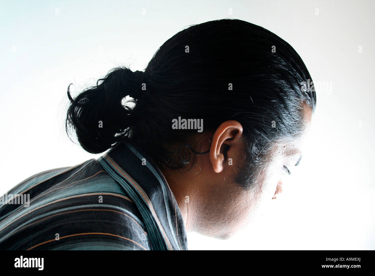 Man with pony tail Stock Photo - Alamy