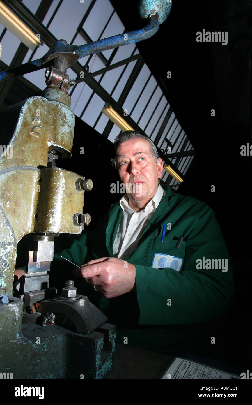 An industrial press worker on his retirement day after 45 years service ...