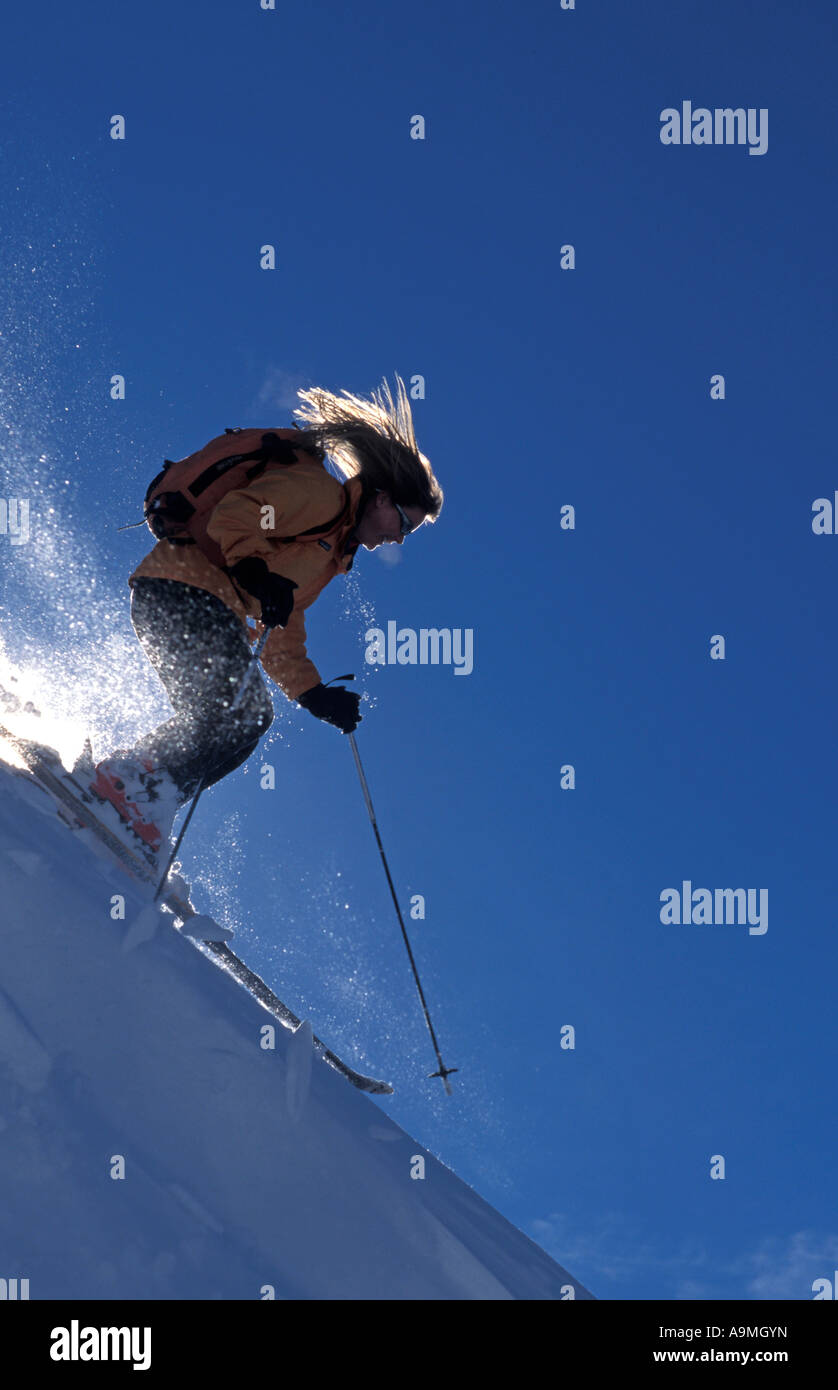 Extreme female skier going fast downhill on an icy piste in the ...