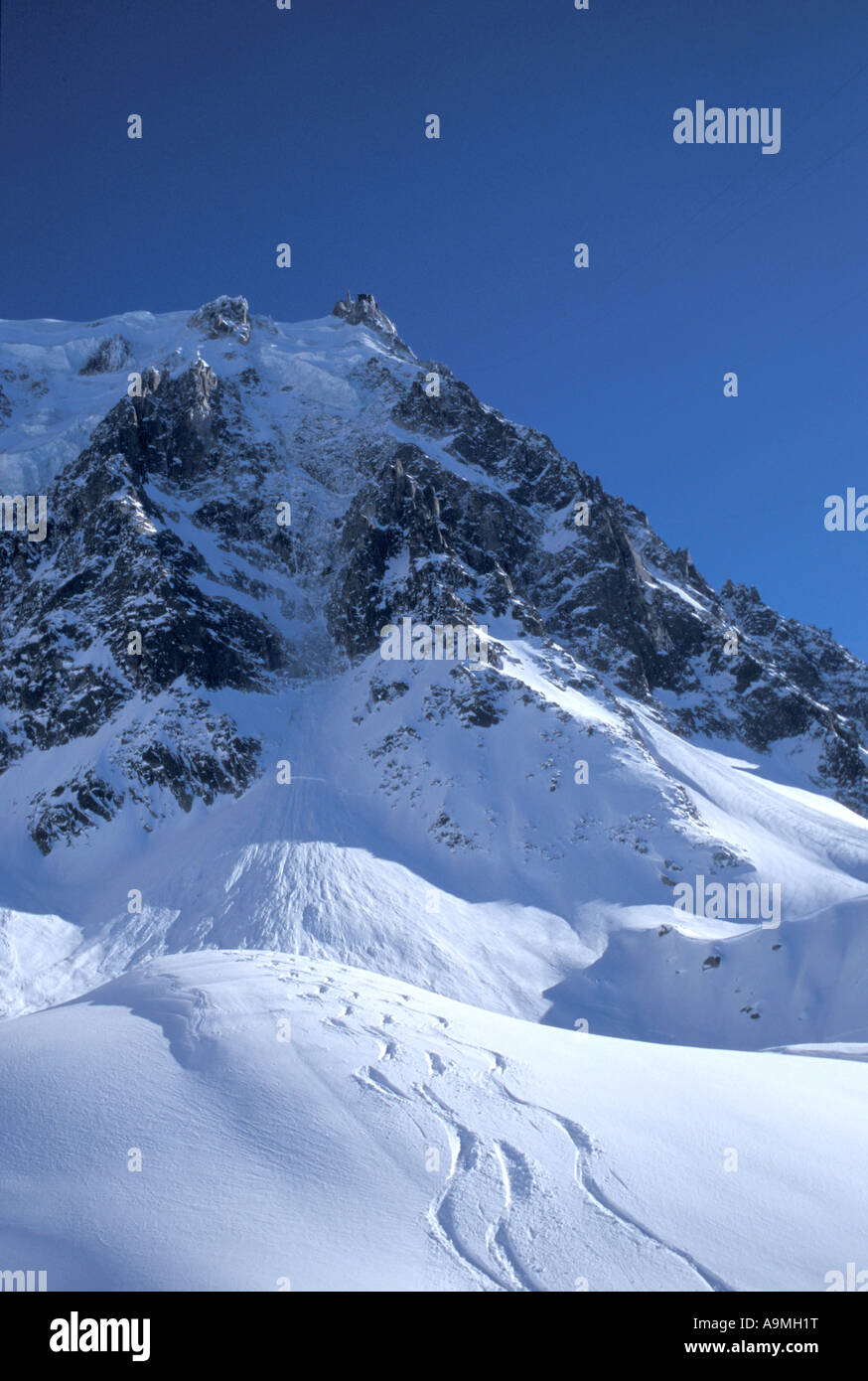 Ski tracks through powder snow below L 'Aiguille du Midi Chamonix ...