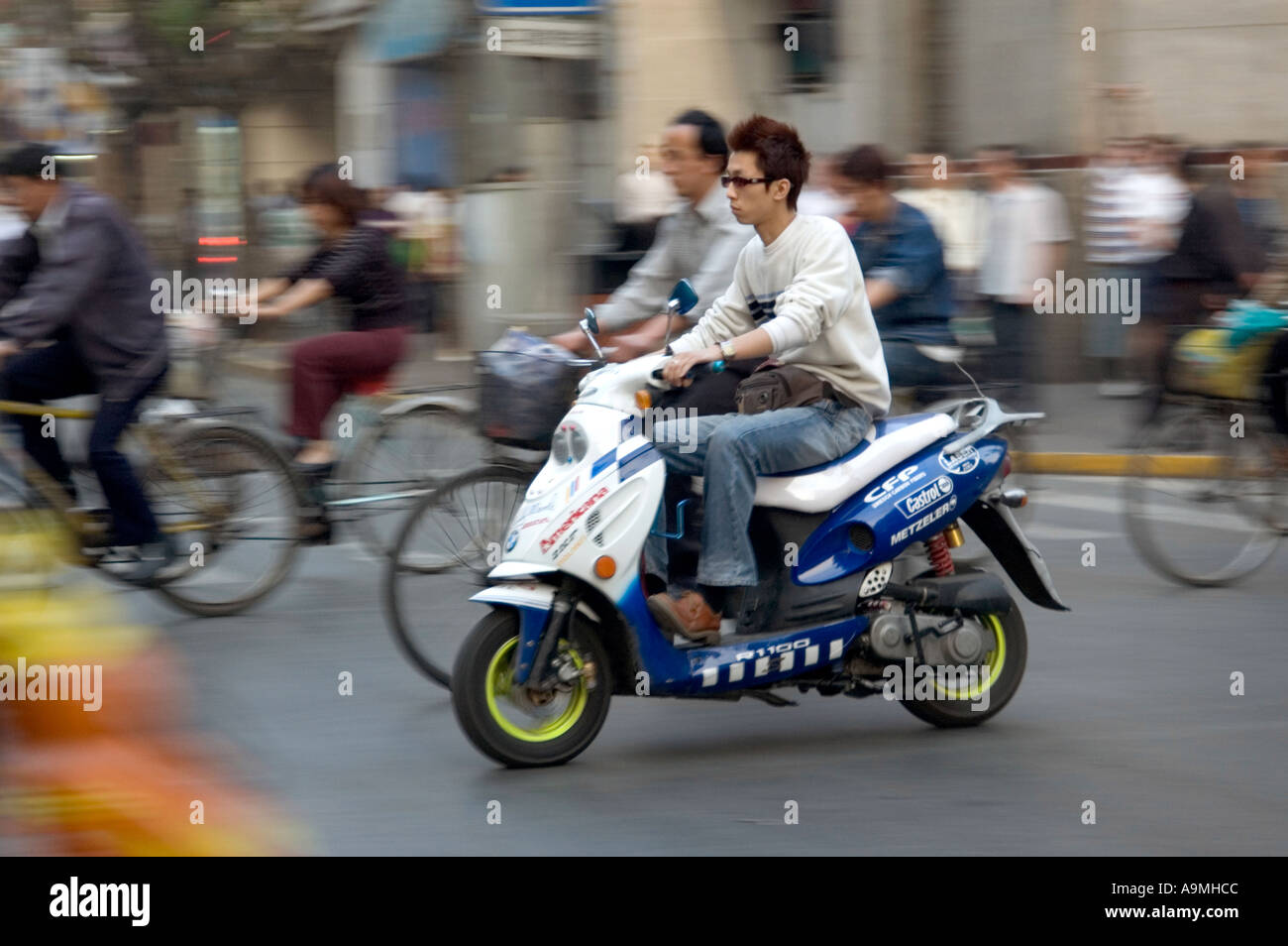 Young chinese man riding motorcycle hi-res stock photography and images ...