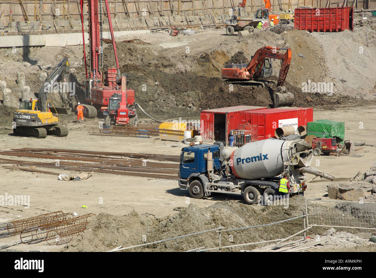 Busy building construction site machines working on foundations ...