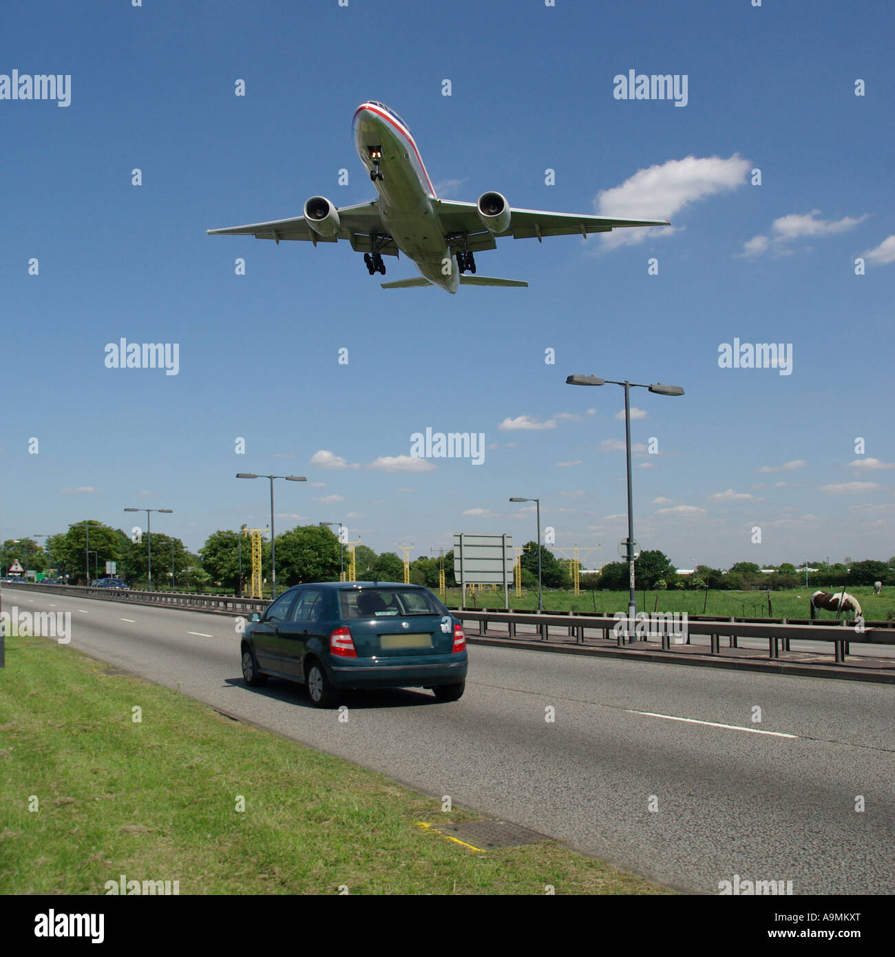 London Heathrow airport low flying jet airliner on landing approach ...