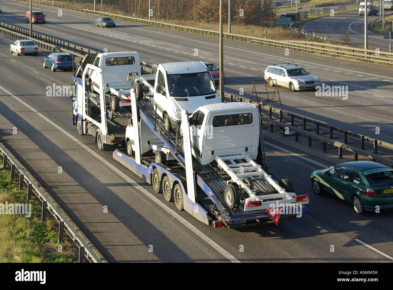 M25 motorway new vehicles on delivery transporter lorry Stock Photo - Alamy