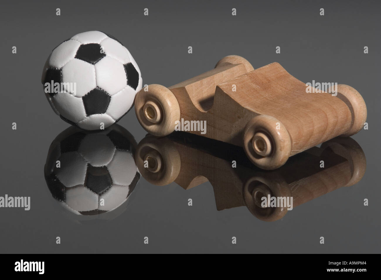 Wooden Toy Car and Soccer Ball Stock Photo - Alamy