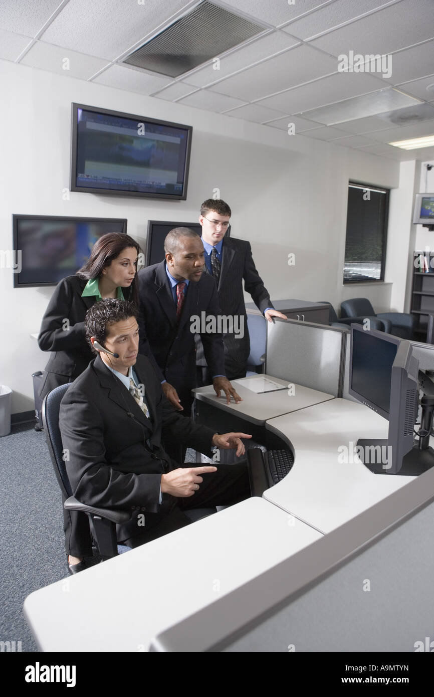 Group around computer screen suits hi-res stock photography and images ...