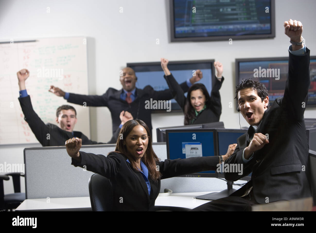Business people cheering in an office Stock Photo - Alamy