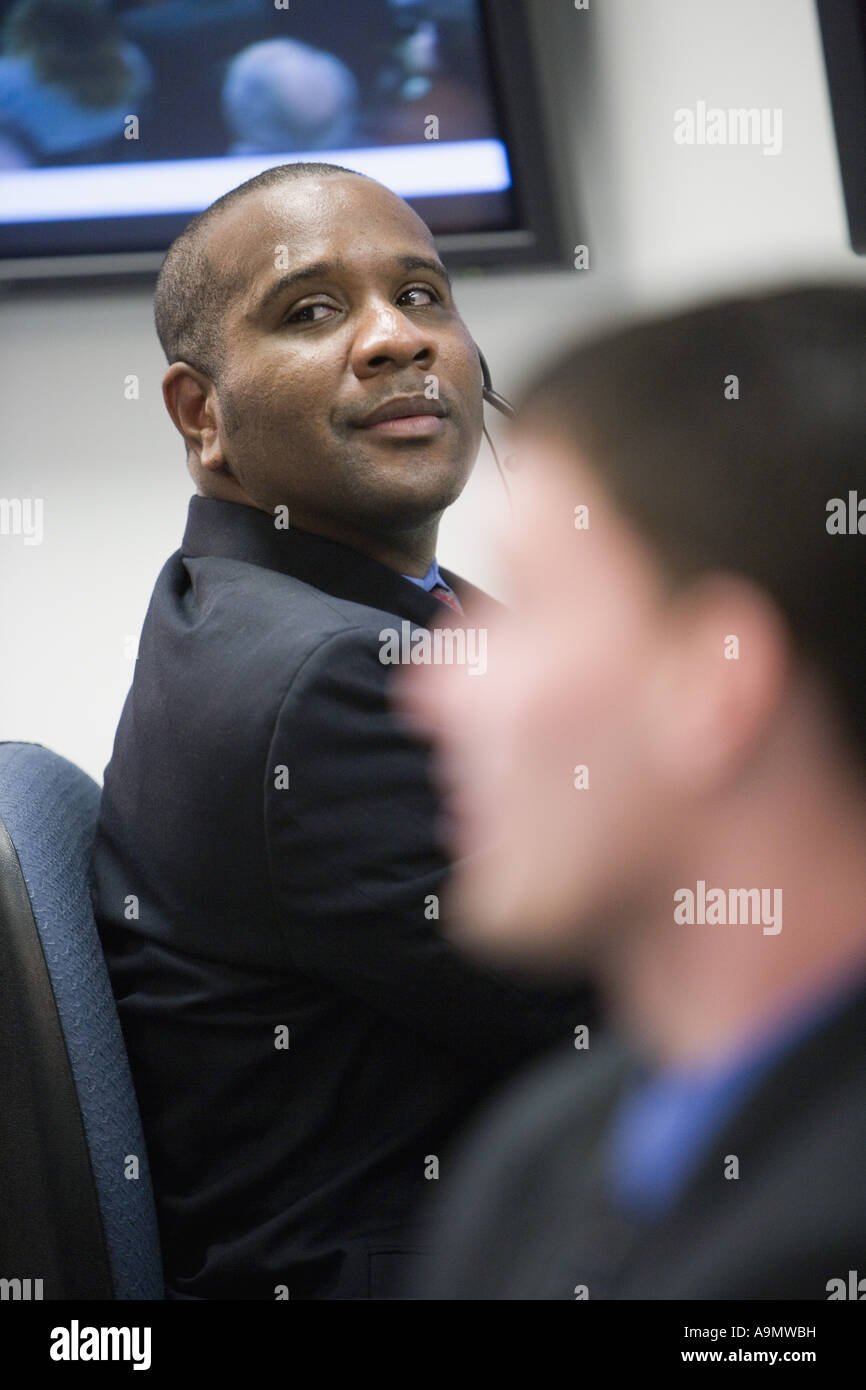 Close-up of a businessman looking over his shoulder Stock Photo - Alamy