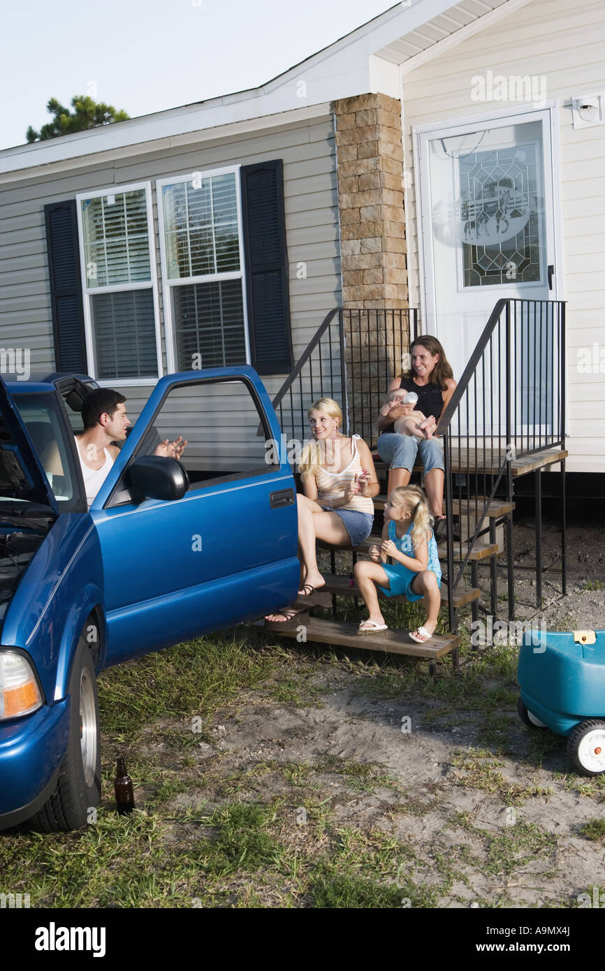 Family in front yard of trailer home Stock Photo - Alamy