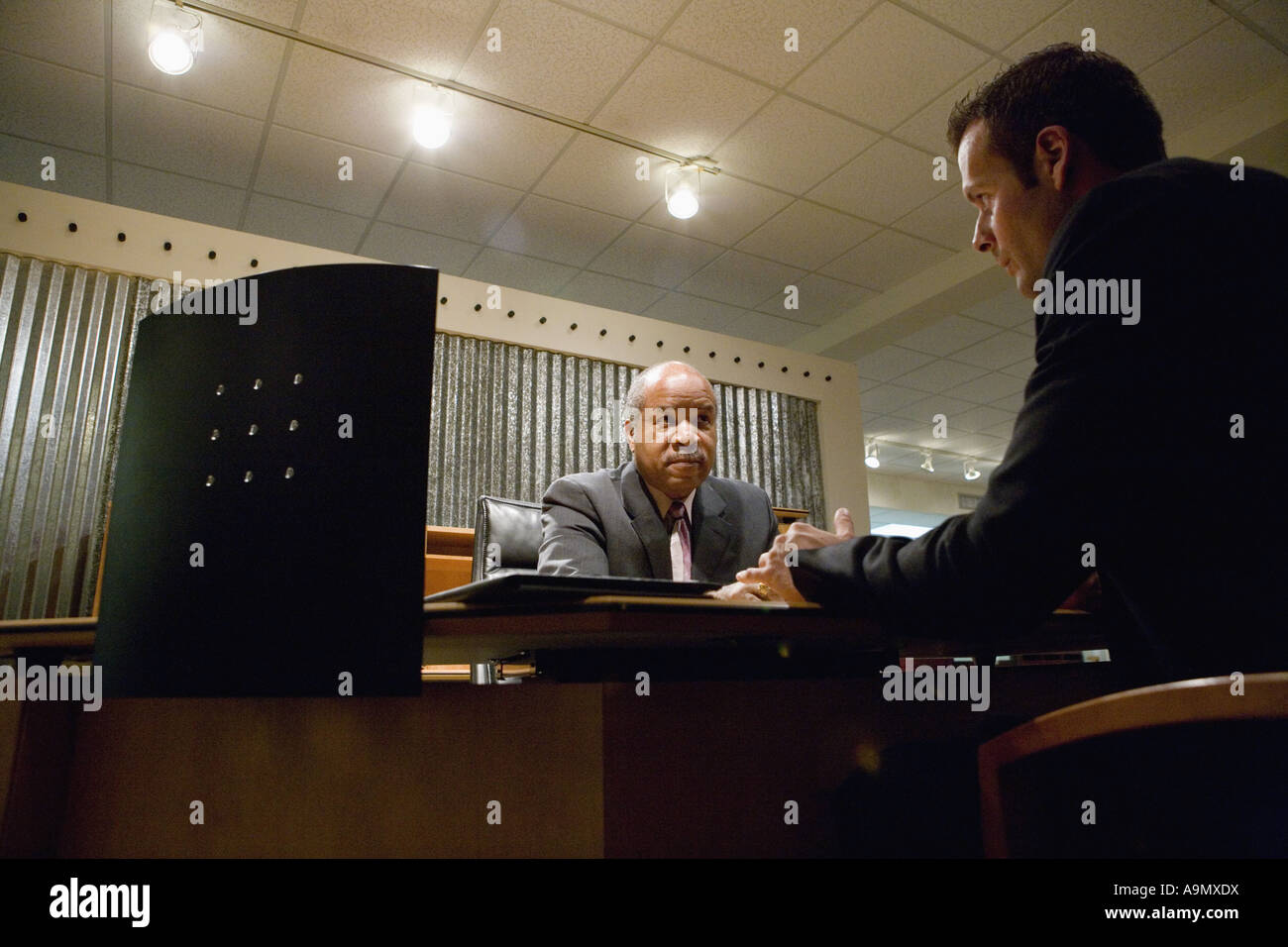 Two businessmen in an office having discussion Stock Photo - Alamy