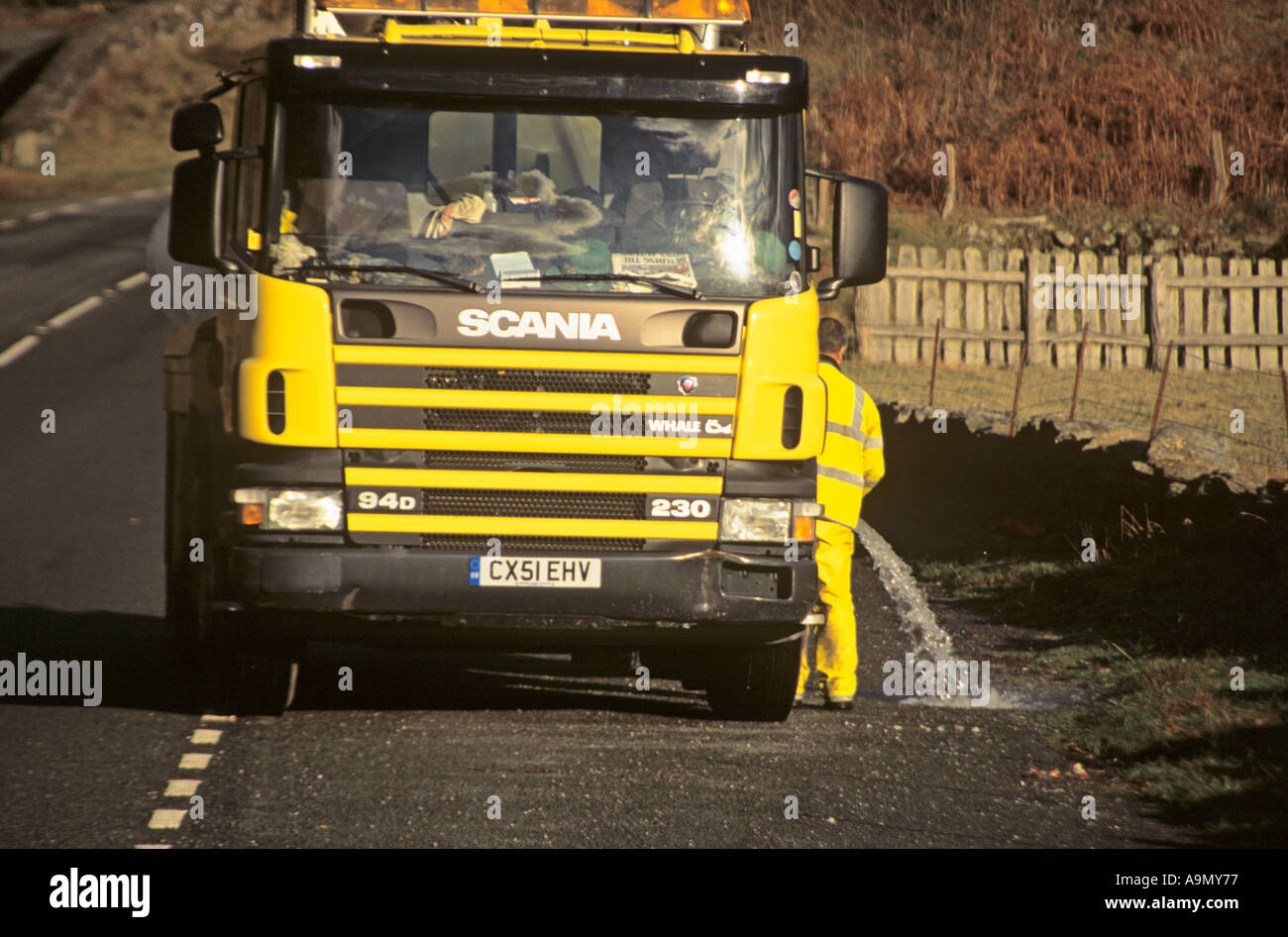 NORTH WALES UK December A bright yellow council services lorry emptying ...