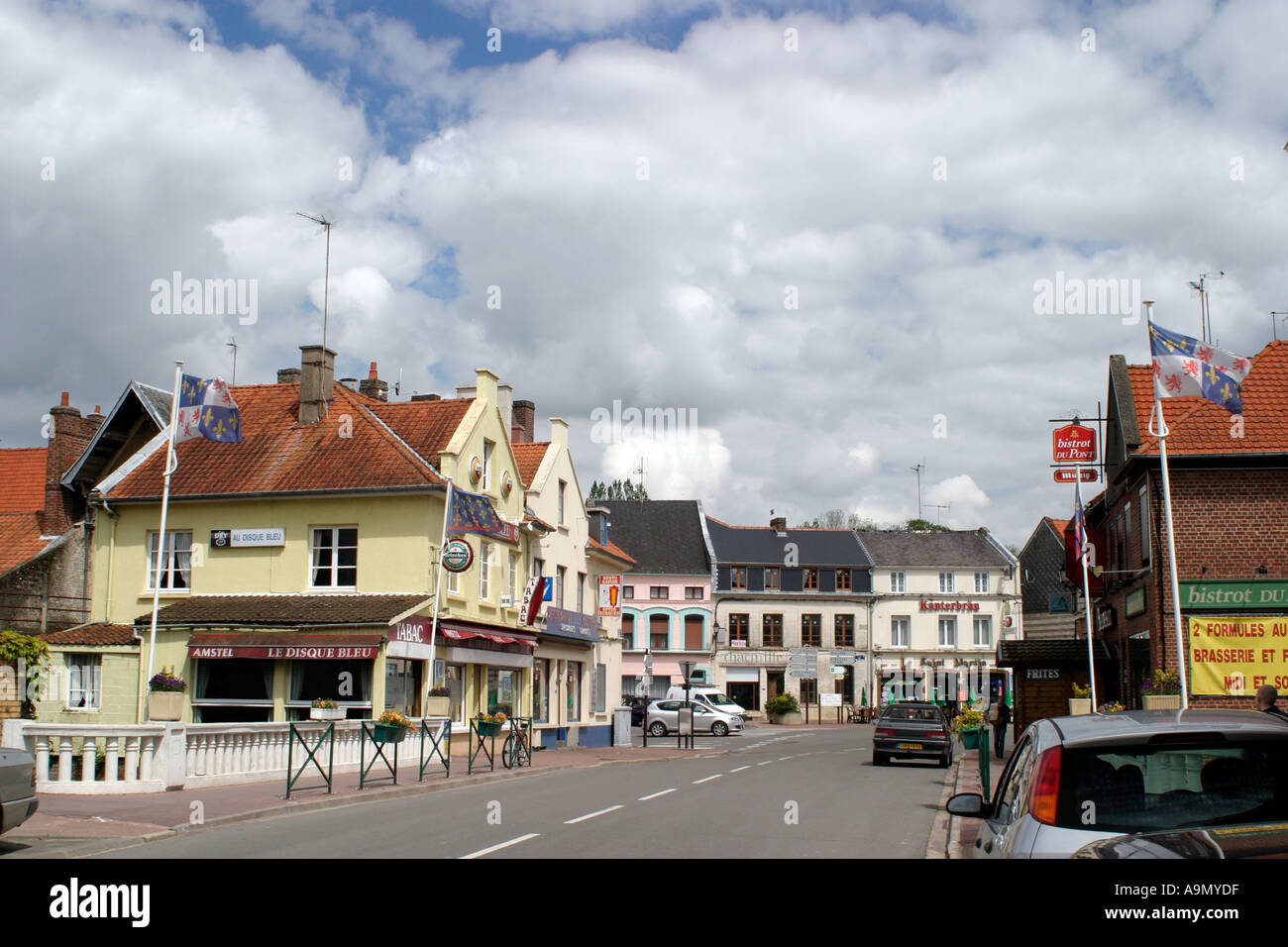 Auxi le Chateau Street scene with restaurants and bridge over River ...