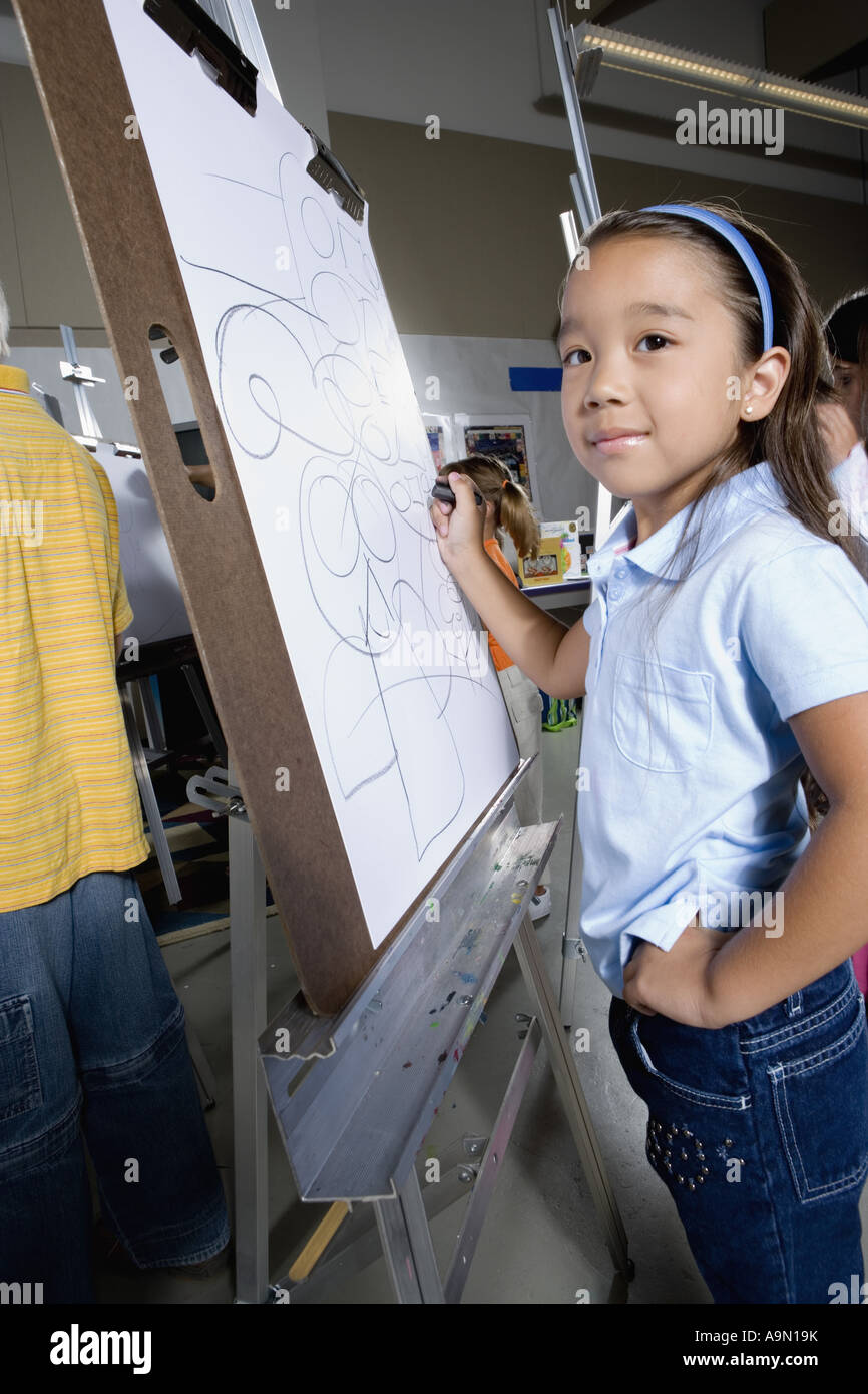 Students drawing on easels in art class Stock Photo - Alamy