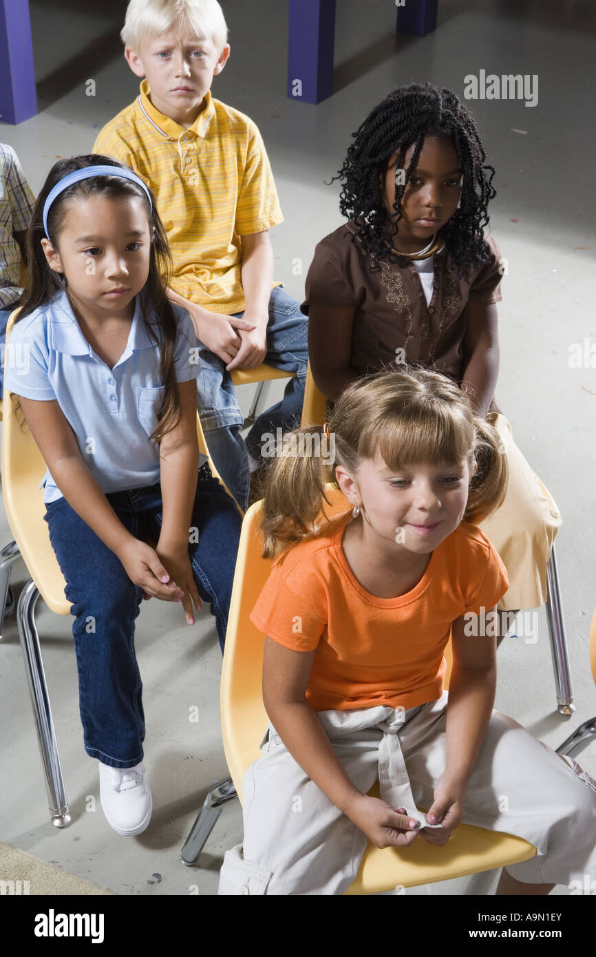 Young students sitting in a classroom Stock Photo - Alamy
