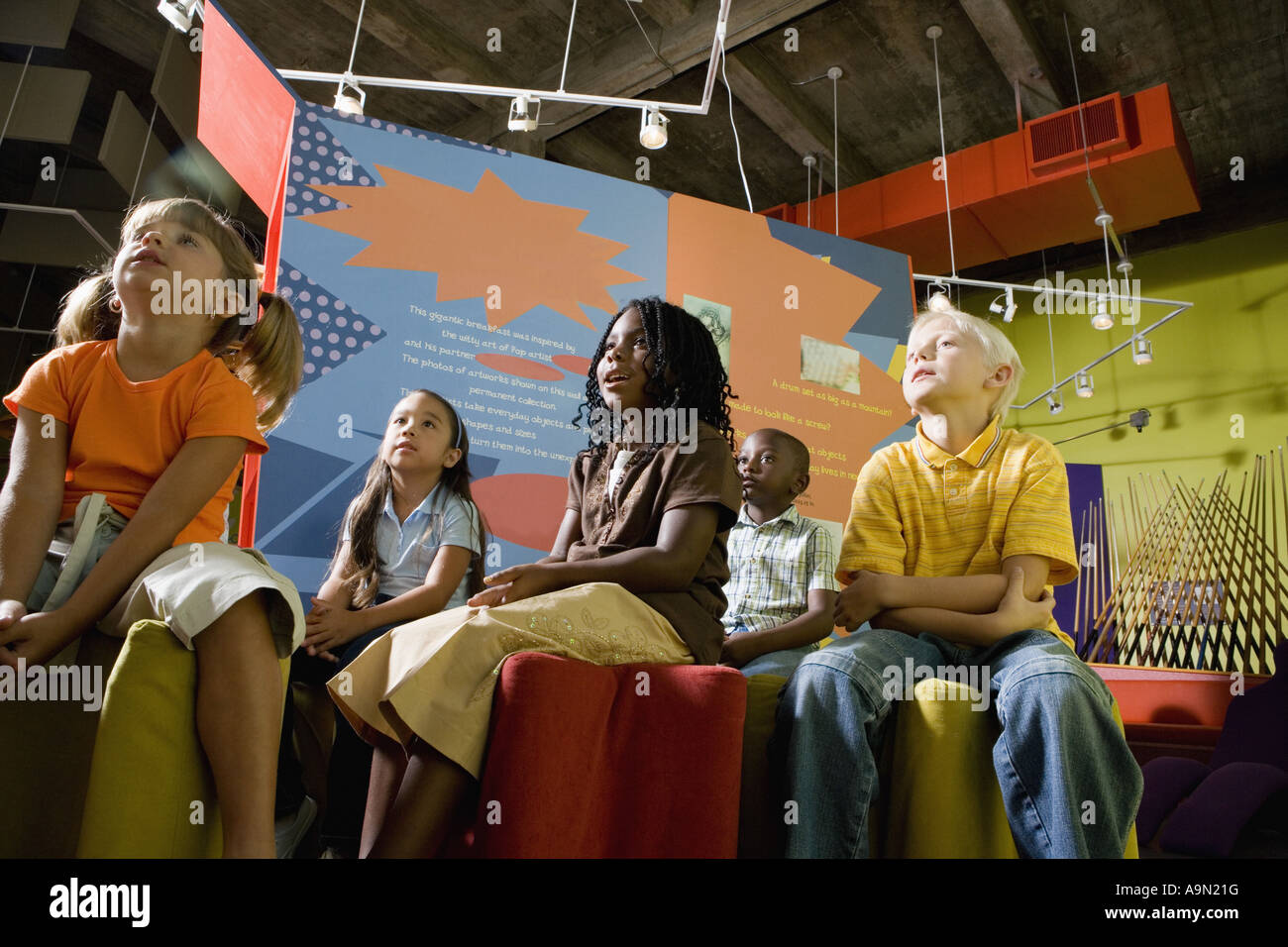 Boys and girls watching and listening attentively in a class Stock ...