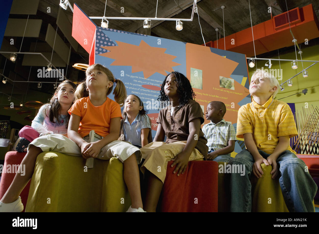 Boys and girls watching and listening attentively in a class Stock ...