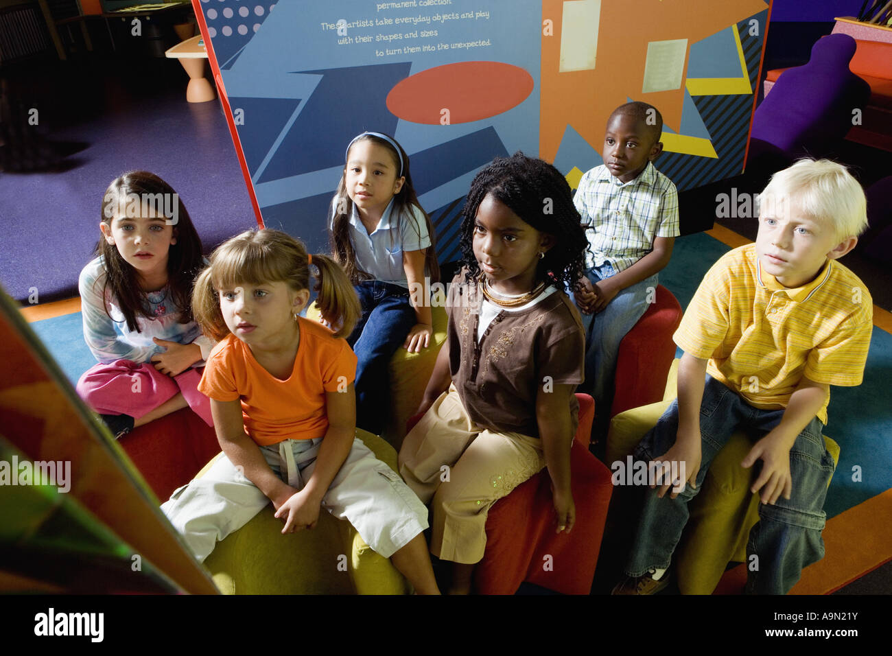 Boys and girls watching and listening attentively in a class Stock ...