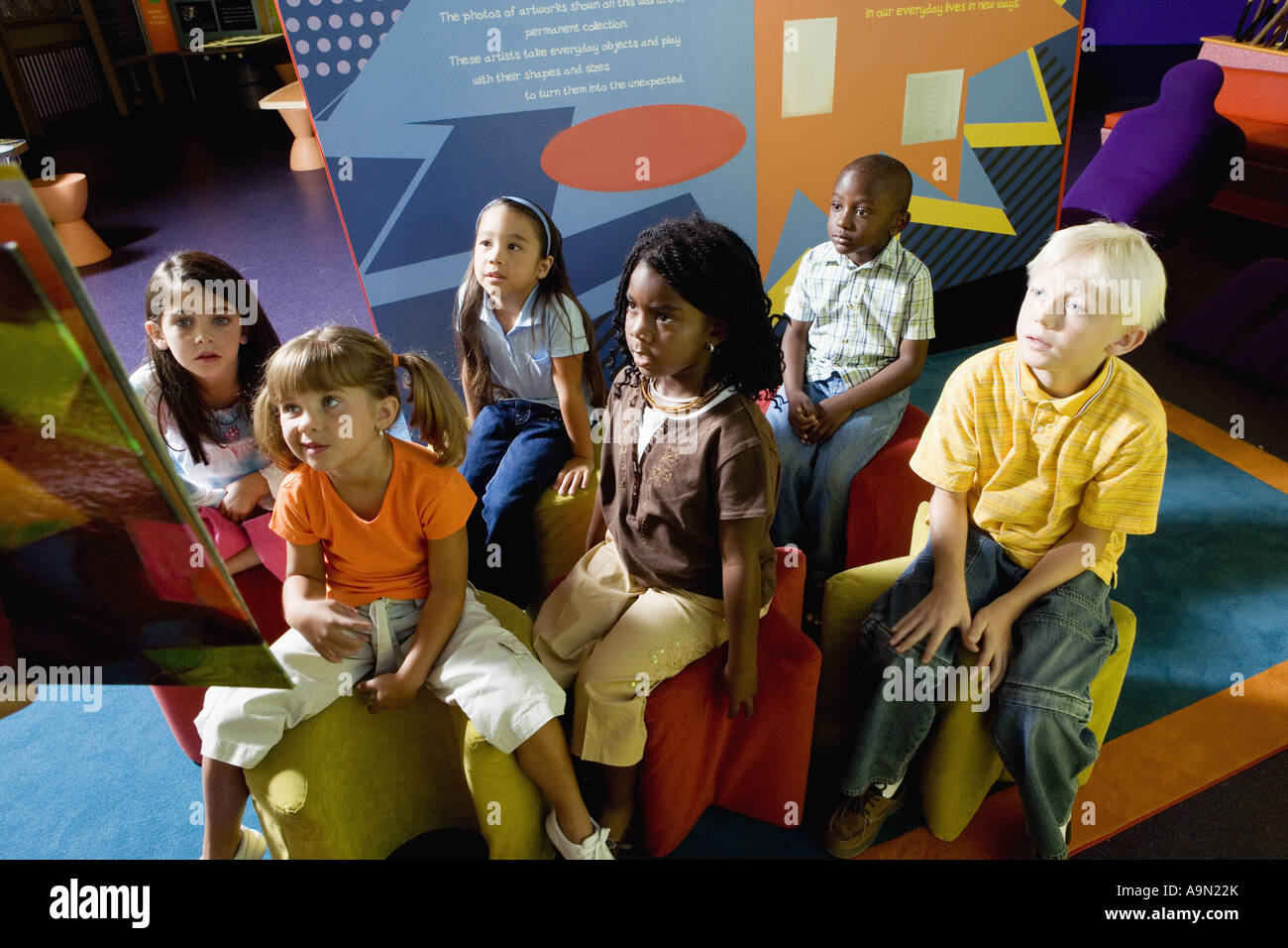 Boys and girls watching and listening attentively in a class Stock ...