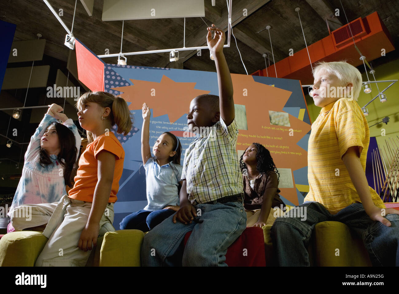 Listening attentively to children hi-res stock photography and images ...