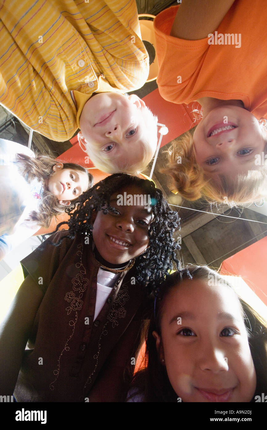 Low angle view of children in a circle looking downwards Stock Photo ...