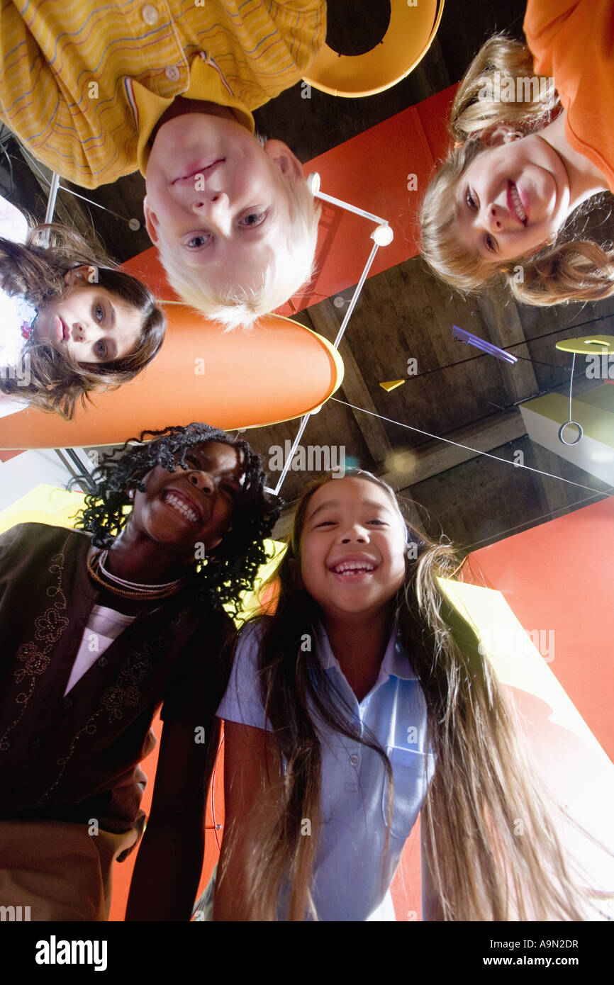Low angle view of children in a circle looking downwards Stock Photo ...