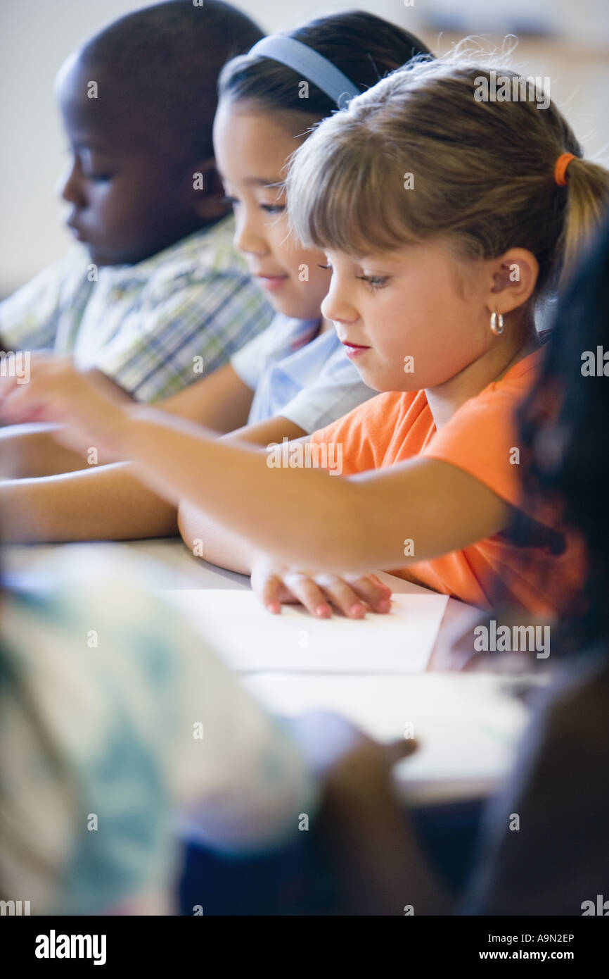 Close up of young children in class Stock Photo - Alamy