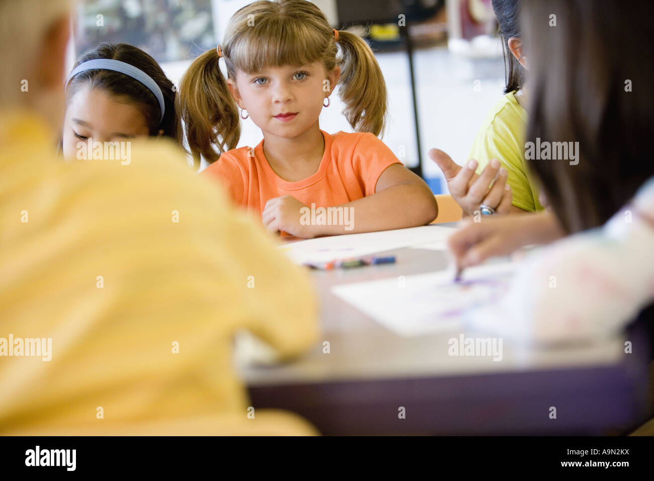 Girls drawing with crayons with friends Stock Photo - Alamy