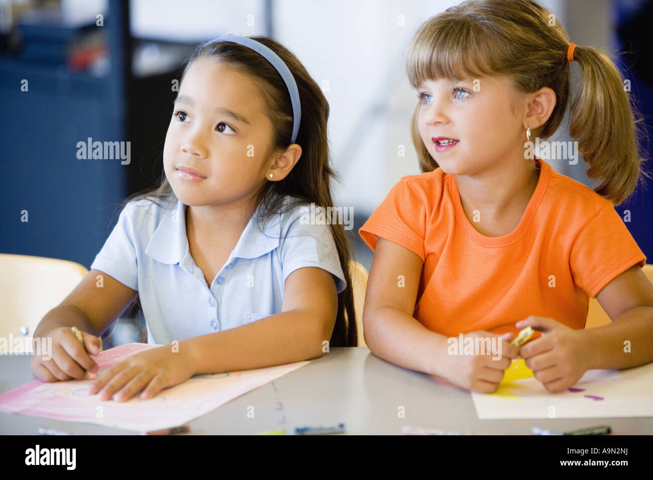 Two little girls coloring together Stock Photo - Alamy