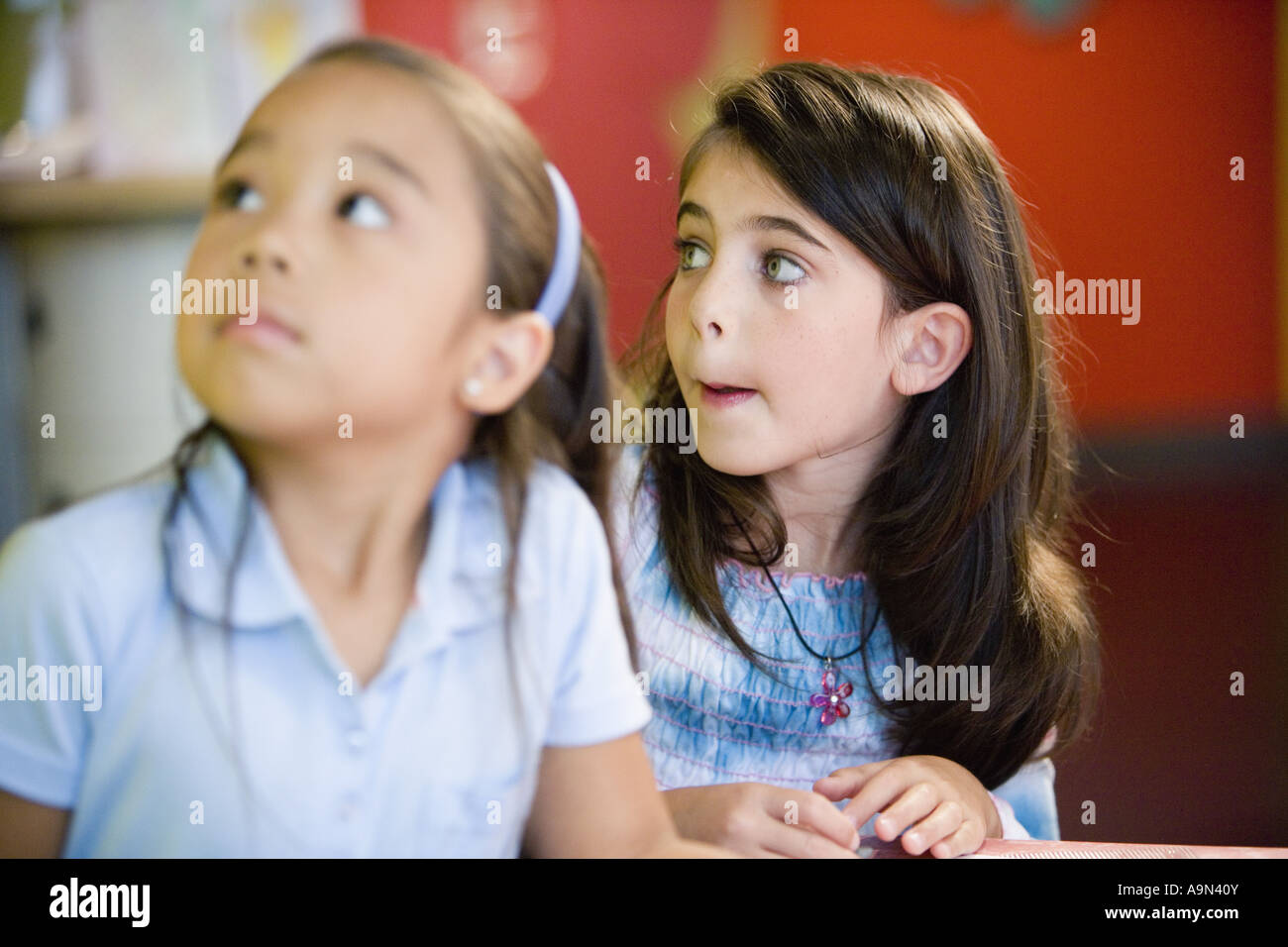 Close up of two little girls side by side Stock Photo - Alamy