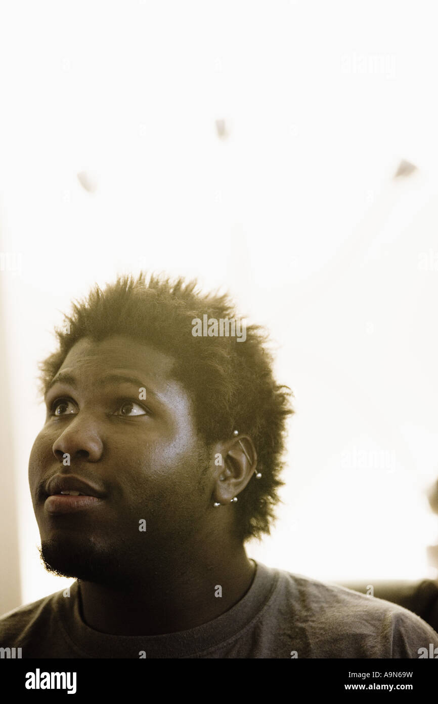 Head-shot of a young man looking up Stock Photo - Alamy
