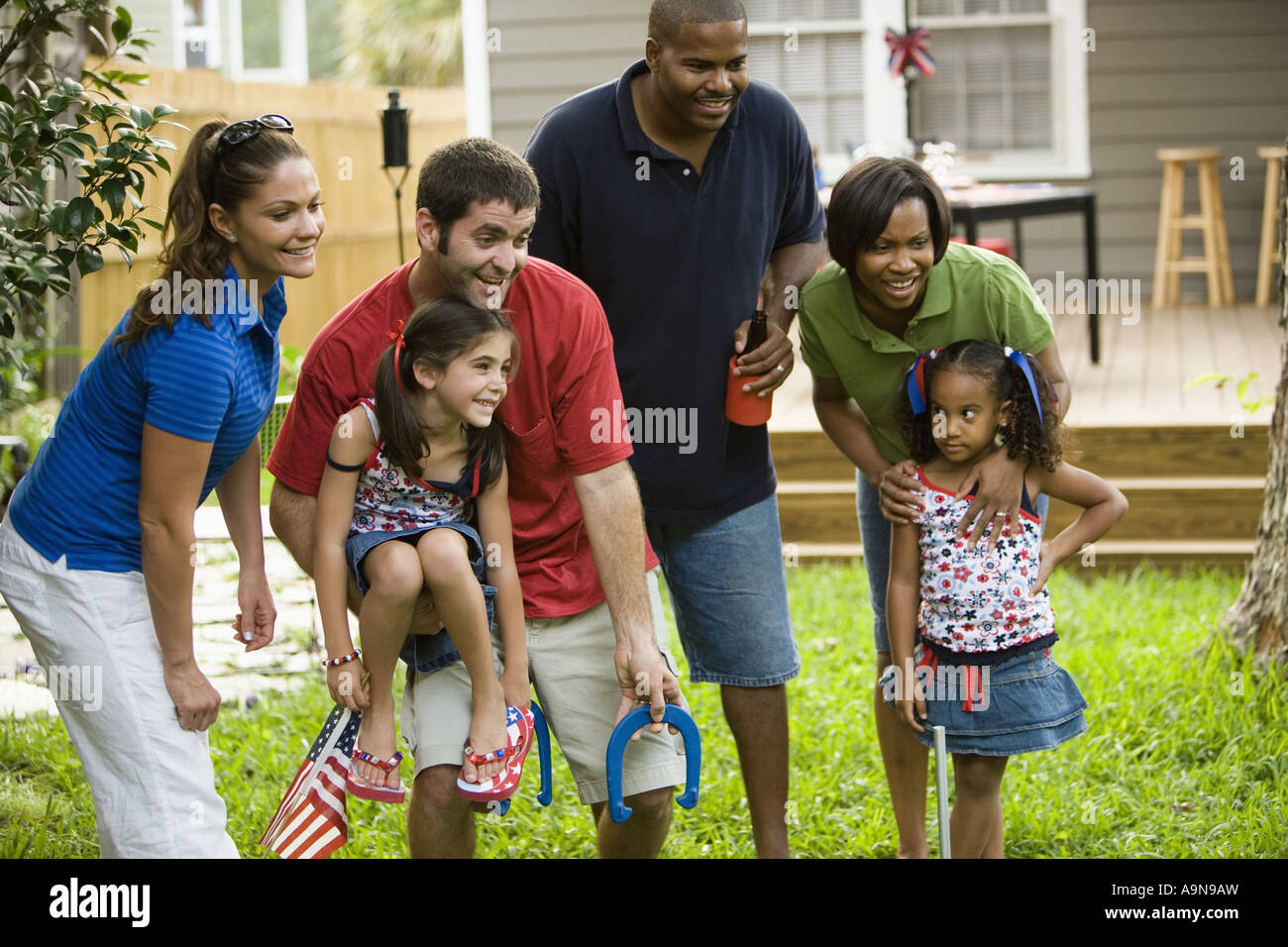 Friendly game of horseshoes Stock Photo - Alamy