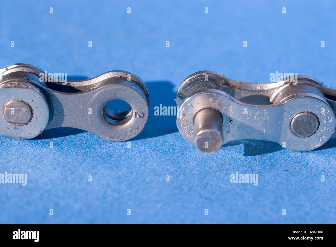 Weakest link broken bicycle chain with link Stock Photo - Alamy