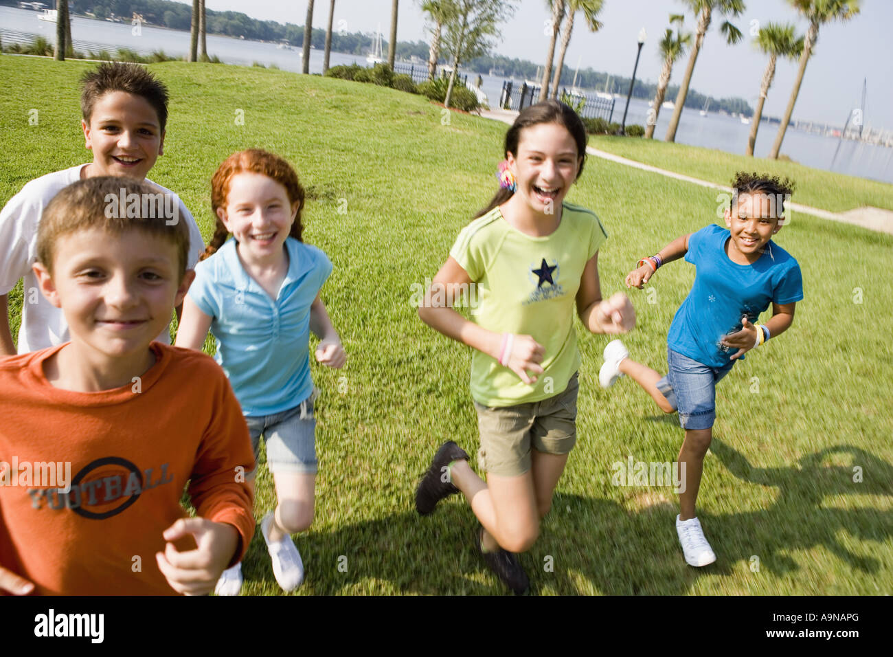 Children running towards the viewer Stock Photo - Alamy