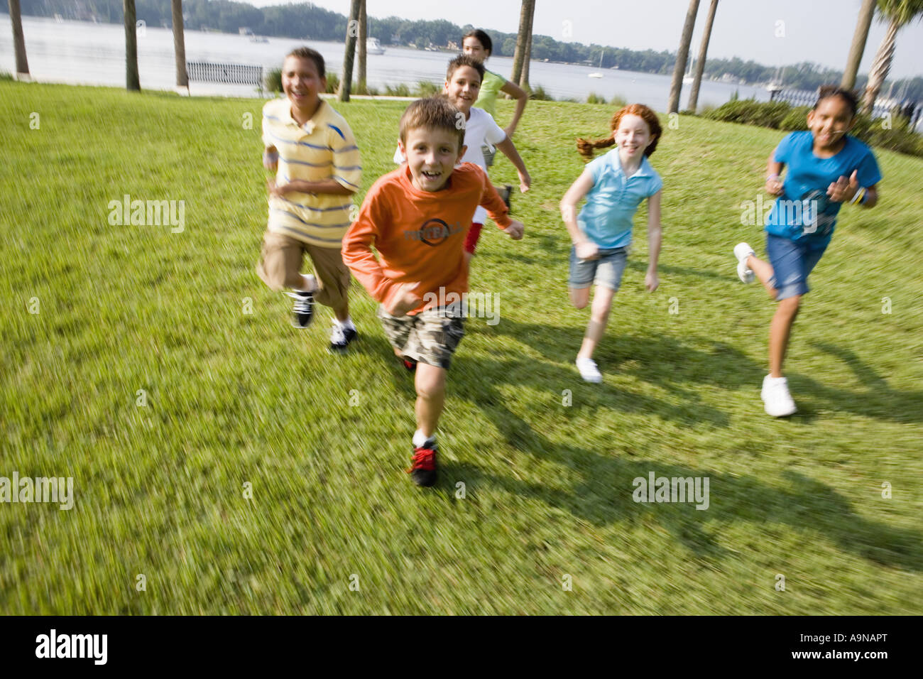 Children running towards the viewer Stock Photo - Alamy