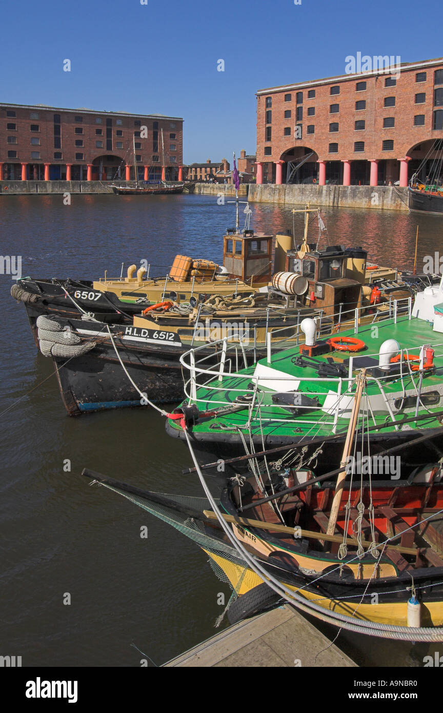 Boats moored inside Albert dock restored warehouse area Liverpool ...