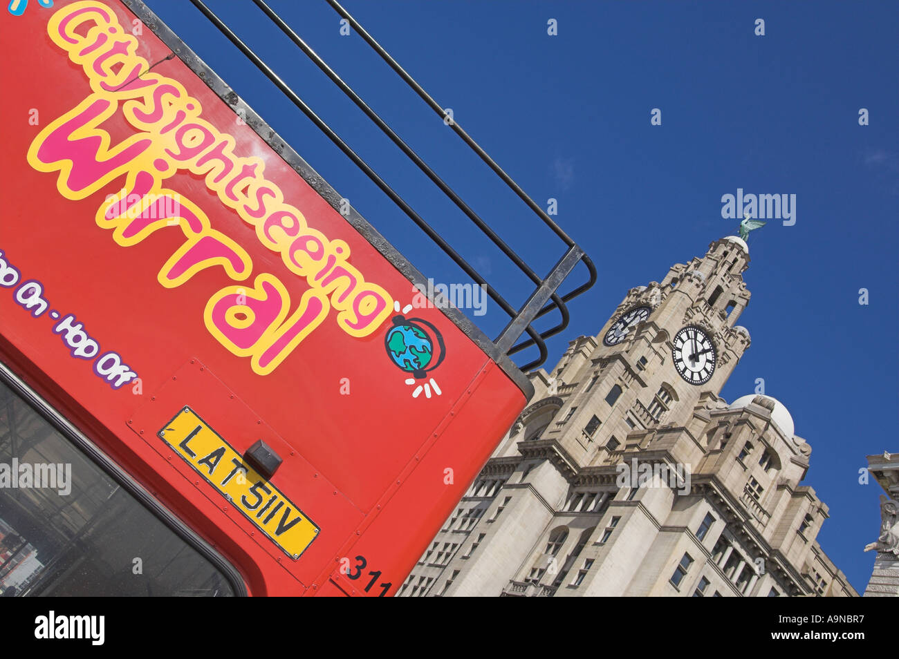 Wirral and Liverpool red city tour bus at the Liver building near ...