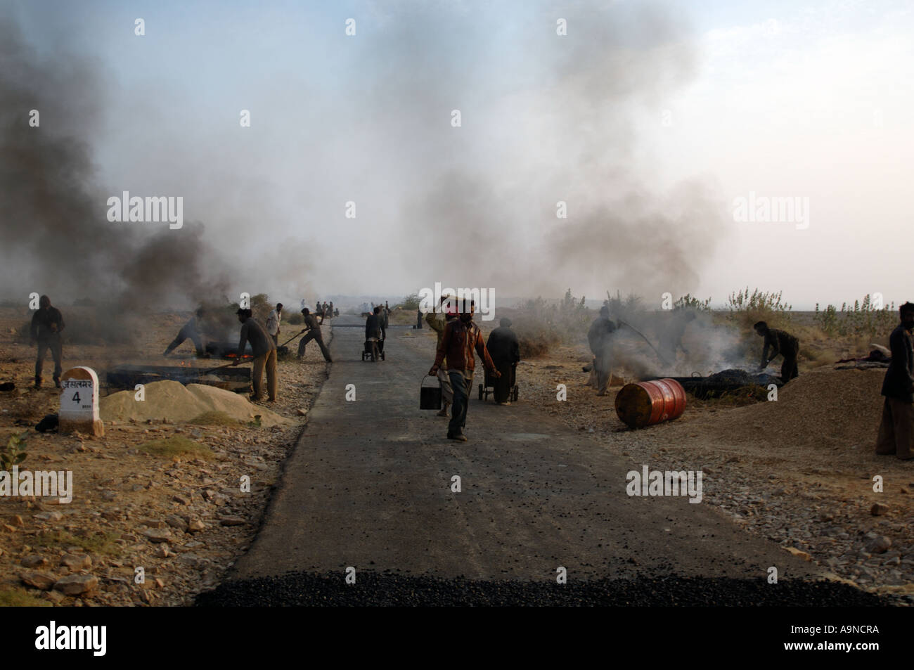 Indian workmen laying a new road in the desert, Rajasthan, India Stock ...