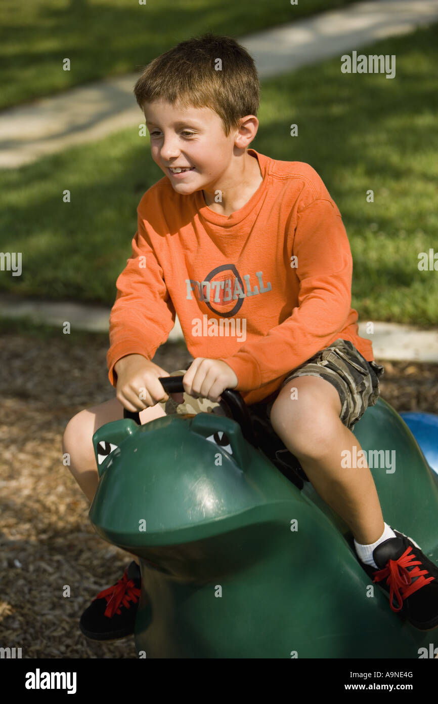 Boy playing at a playground Stock Photo - Alamy